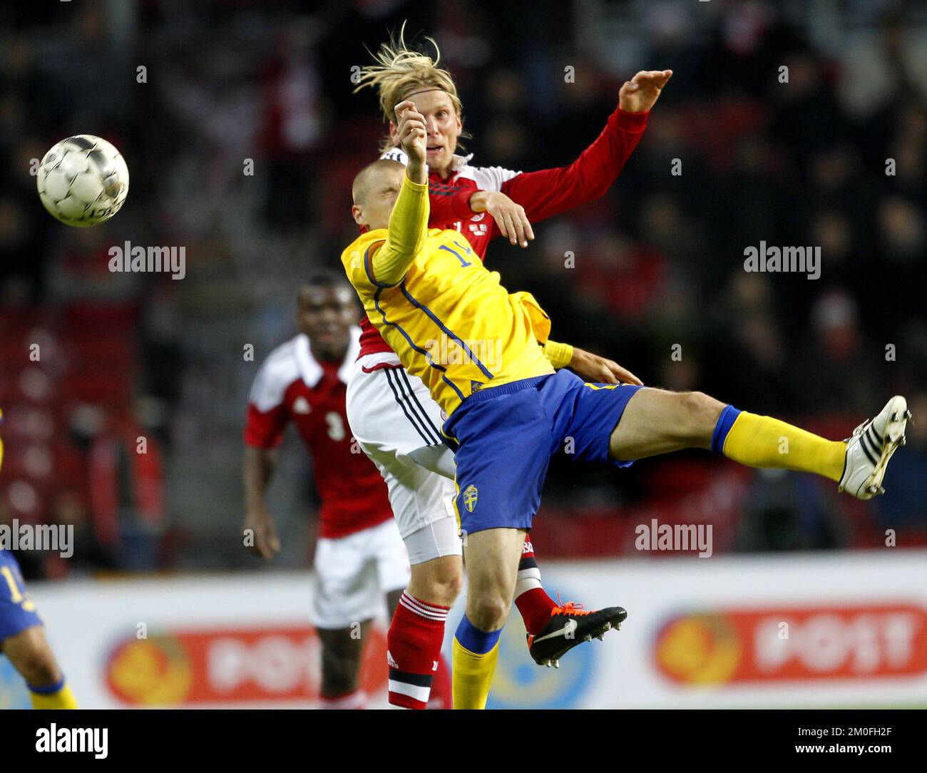 Denmark's Christian Poulsen and Sweden's Samuel Holmen (bottom) battle ...