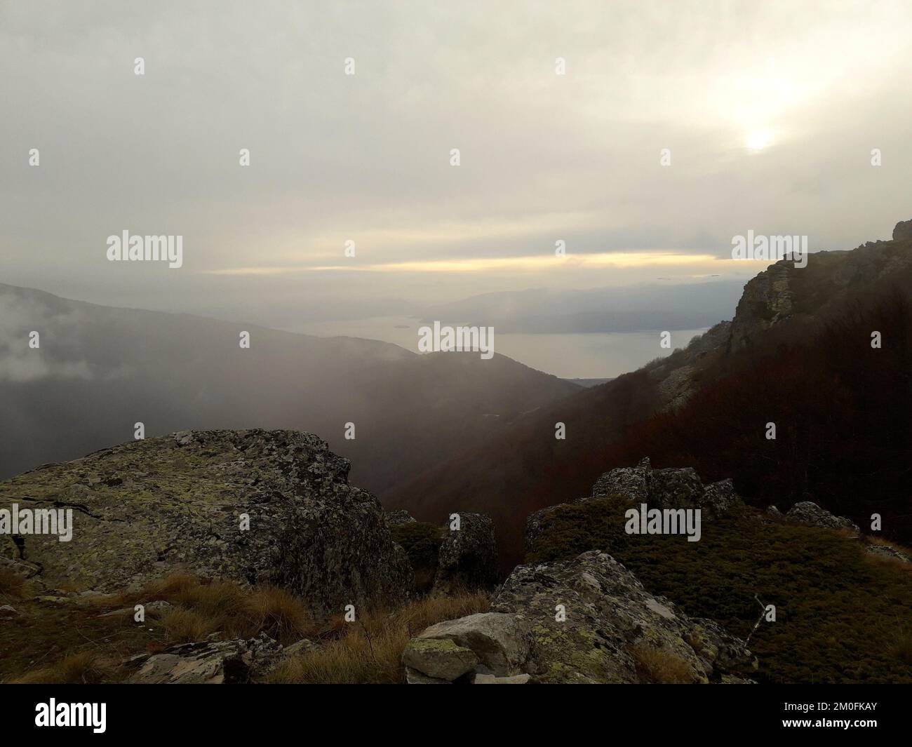 A view from height to the valley of the misty mountains before the lake ...