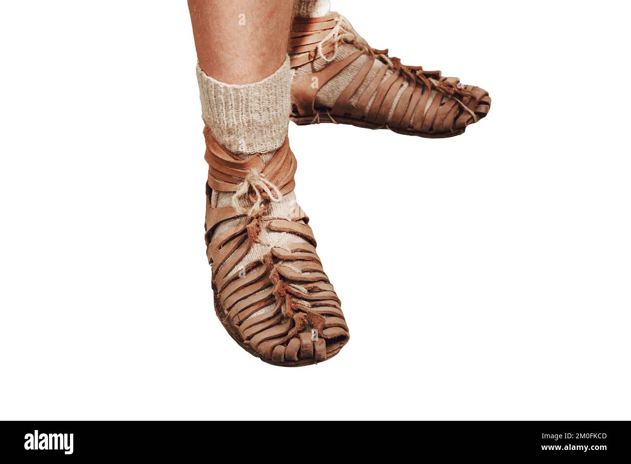 An ancient Roman man legs in caligae leather sandals, isolated on a ...