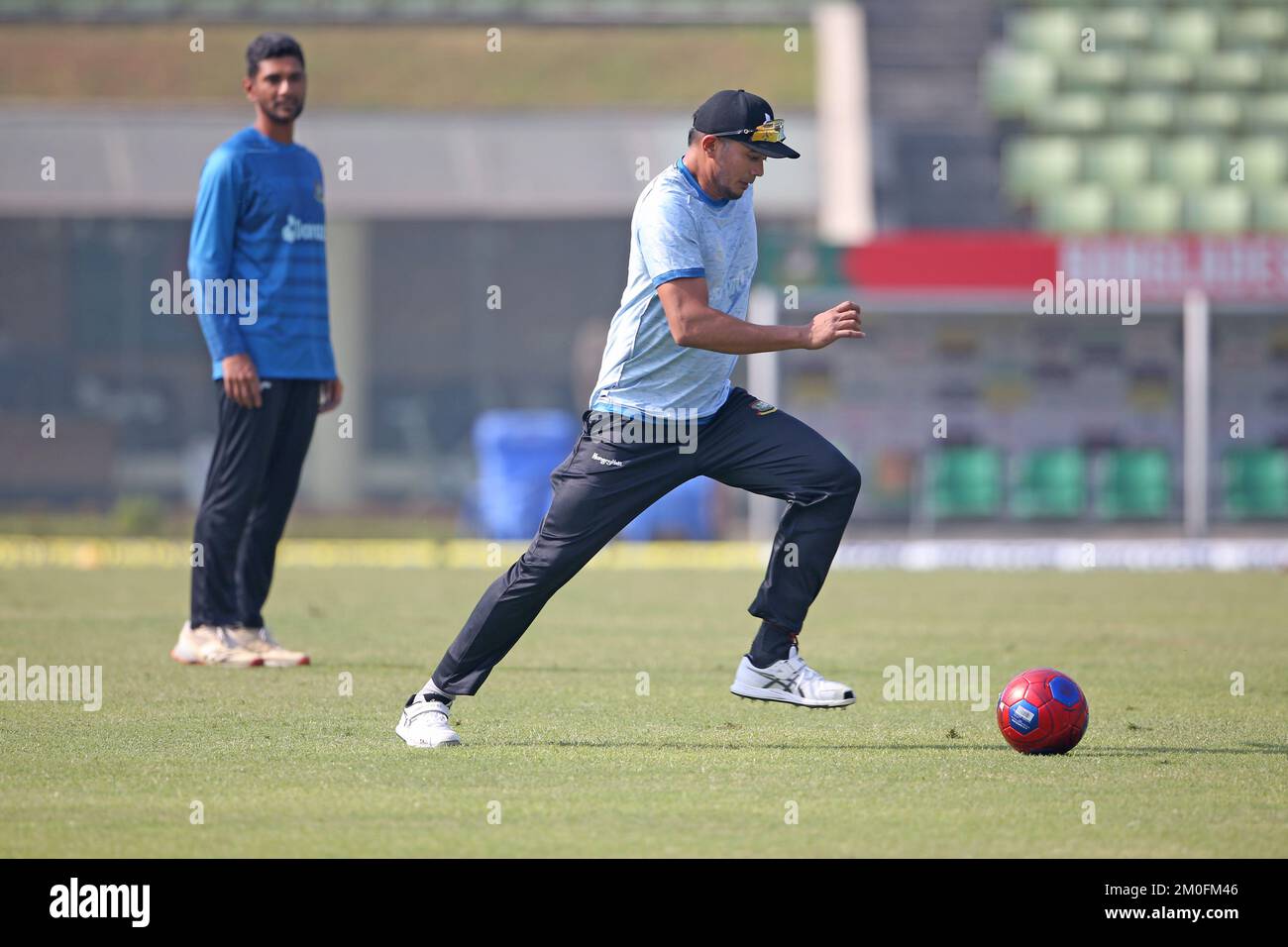 Bangladeshi Fast bowler Tashkin Ahmed plays football along his ...
