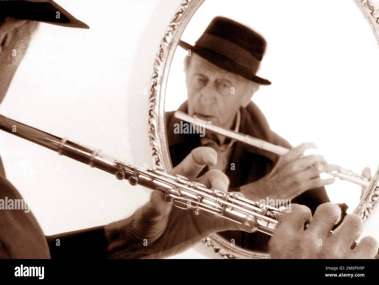 Old man playing flute in hi-res stock photography and images - Alamy