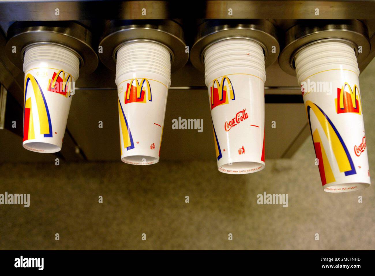 An ordinary day at McDonalds in Copenhagen. Drinking cups in different ...