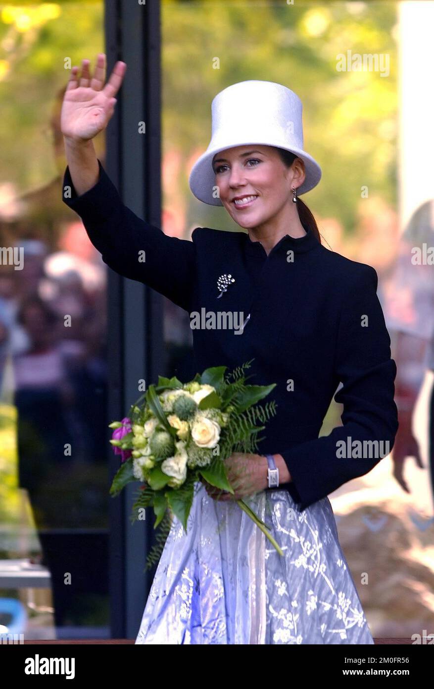 The Danish Crown Princess Mary waves to supporters as she along with ...