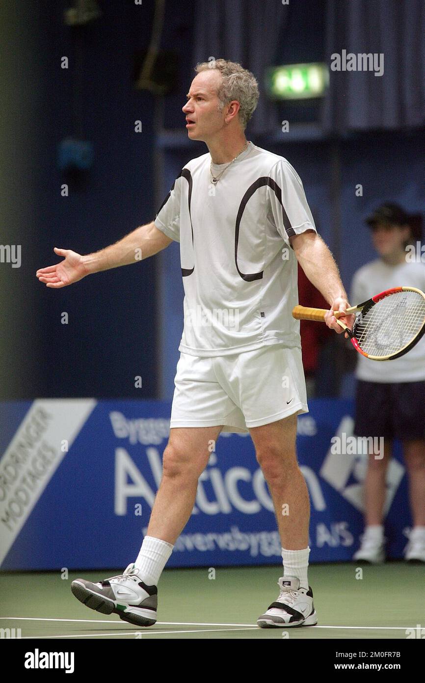American John McEnroe in action against frenchman Henri Leconte during ...