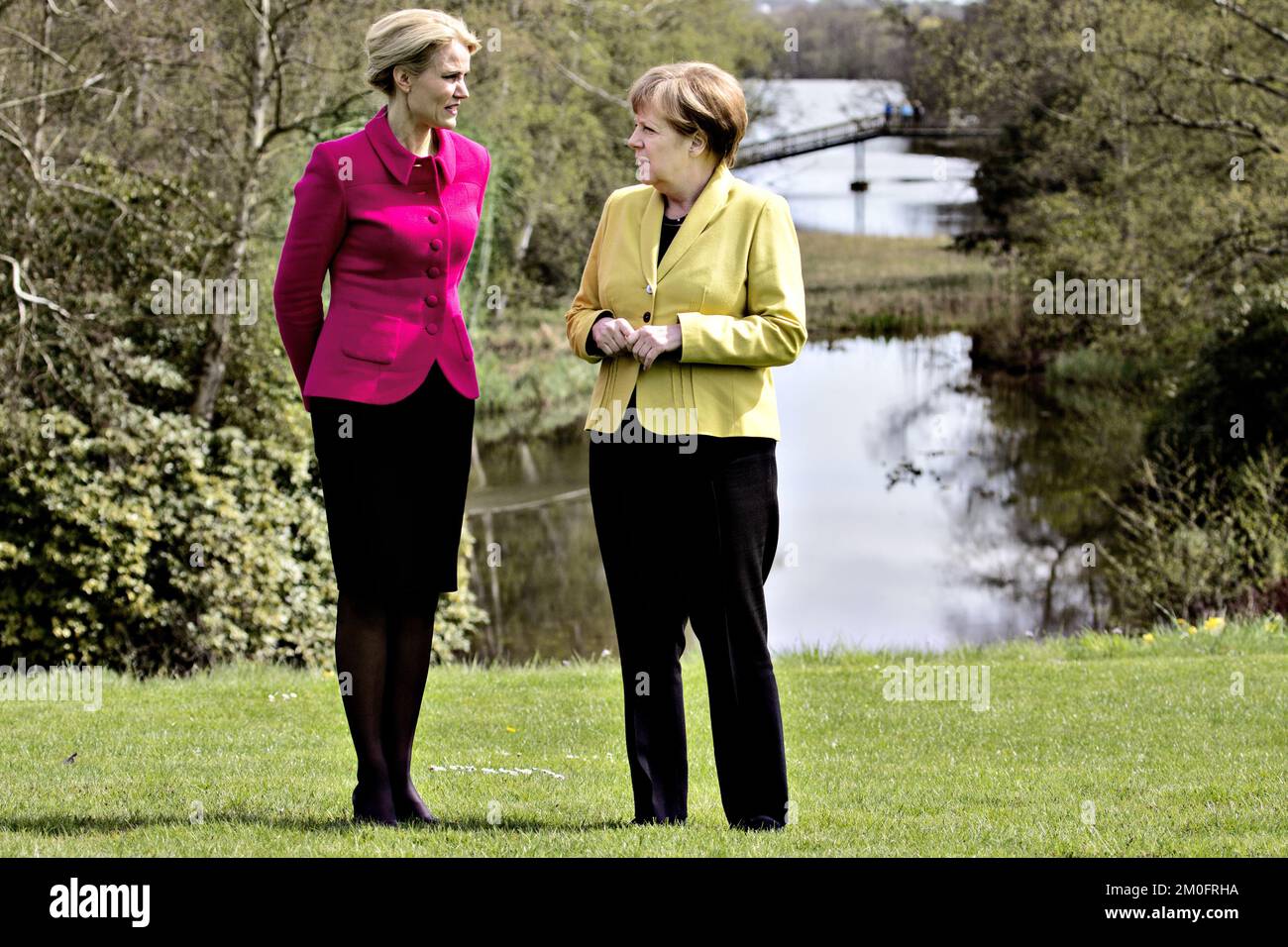German Chancellor Angela Merkel (R) and Danish Prime Minister Helle ...