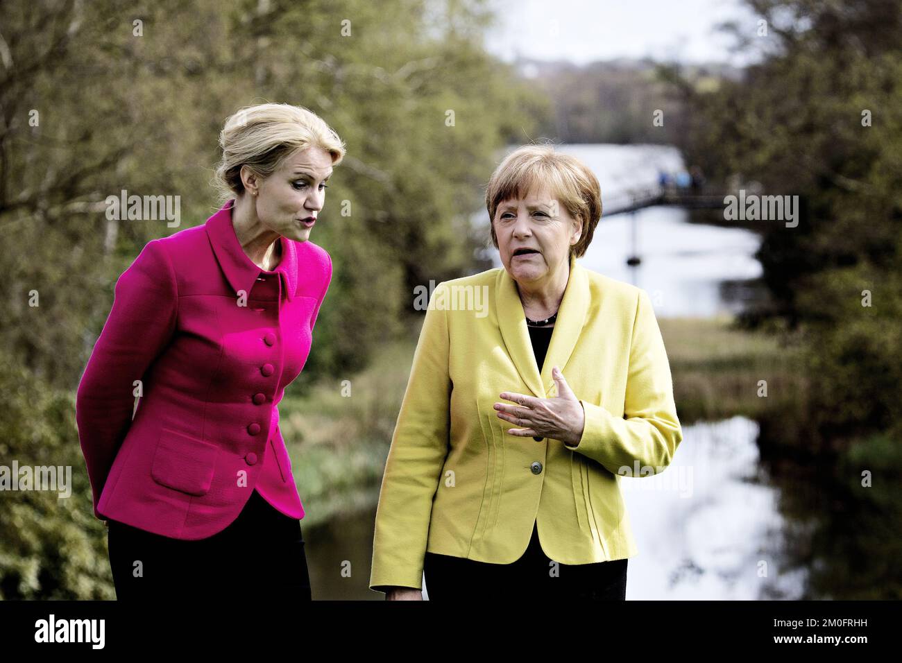 German Chancellor Angela Merkel (R) and Danish Prime Minister Helle ...