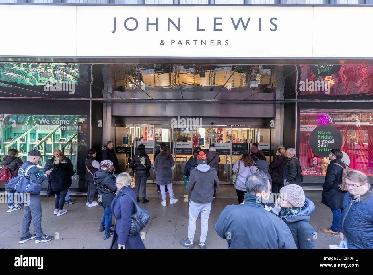 People seen queuing outside John Lewis on Oxford Street this morning ...