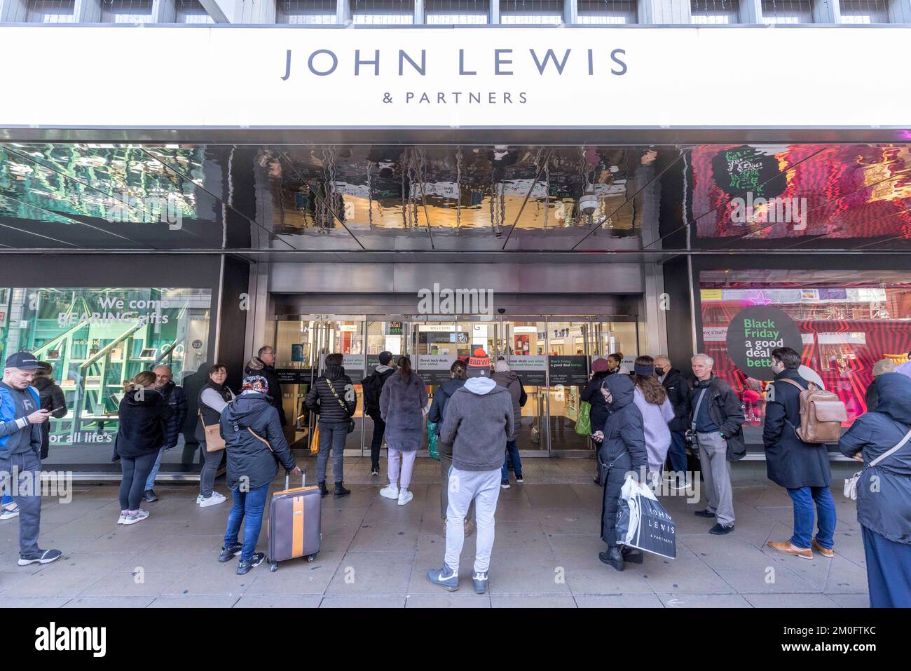 People seen queuing outside John Lewis on Oxford Street this morning ...