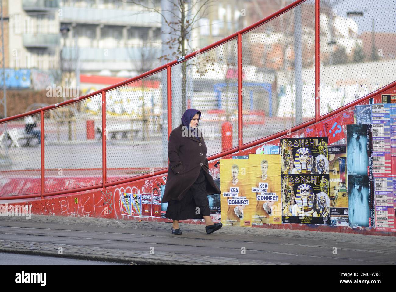 Muslim woman walks at Norrebrogade on Nørrebro, at the red square where ...