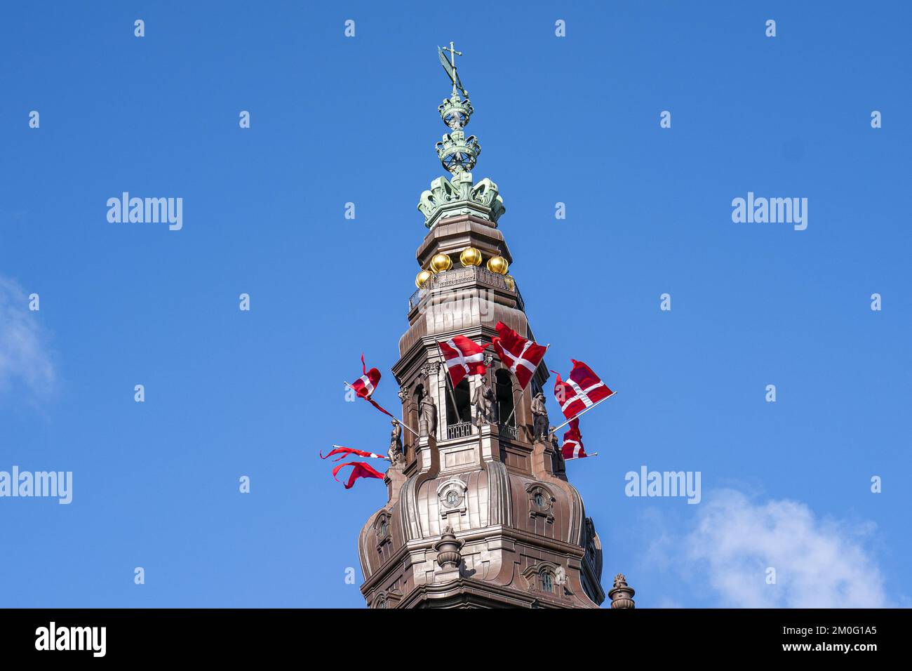 The Danish flag is displayed on the tower of the Danish Parliament in ...