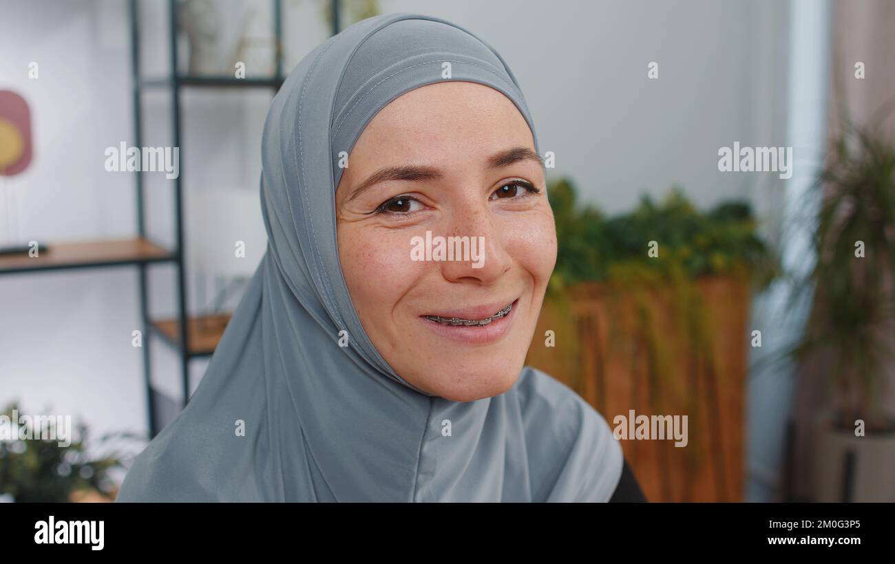 Portrait of happy calm young muslim business woman wearing hijab ...