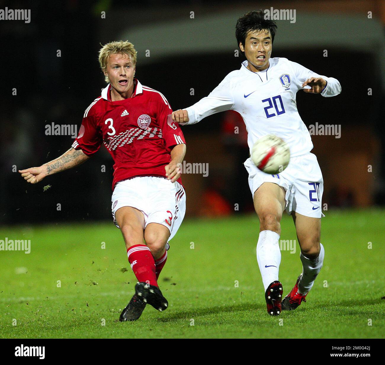Denmarks simon kjaer south lee dong gook battle for the ball hi-res ...
