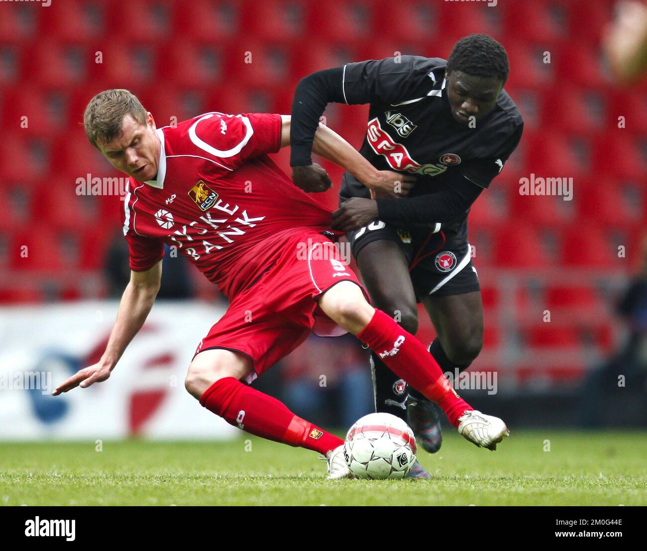 FC Midtjylland's Baba Collins and Nordsjaellands Andreas Bjelland ...