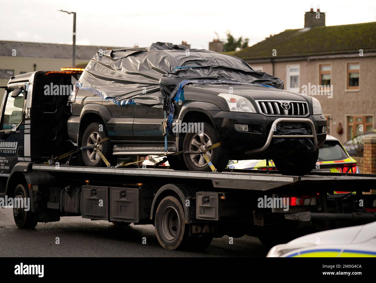 A black Toyota Land Cruiser is taken away from the scene in Ronanstown ...
