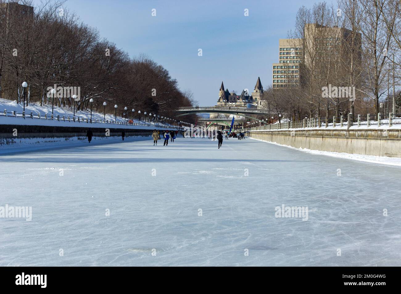 A view of people skating on the Rideau Canal during Winterlude with the ...