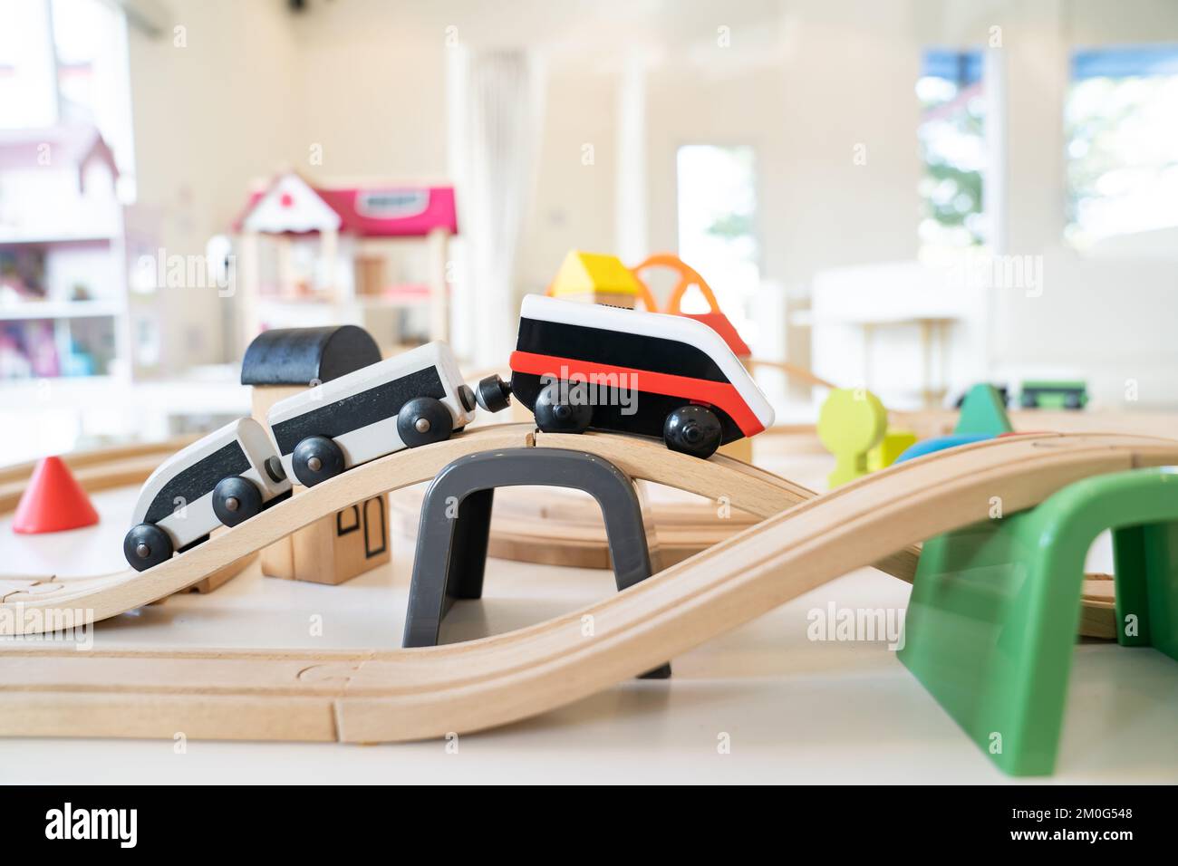 a wooden electric train and railway toy set for children in a daycare ...