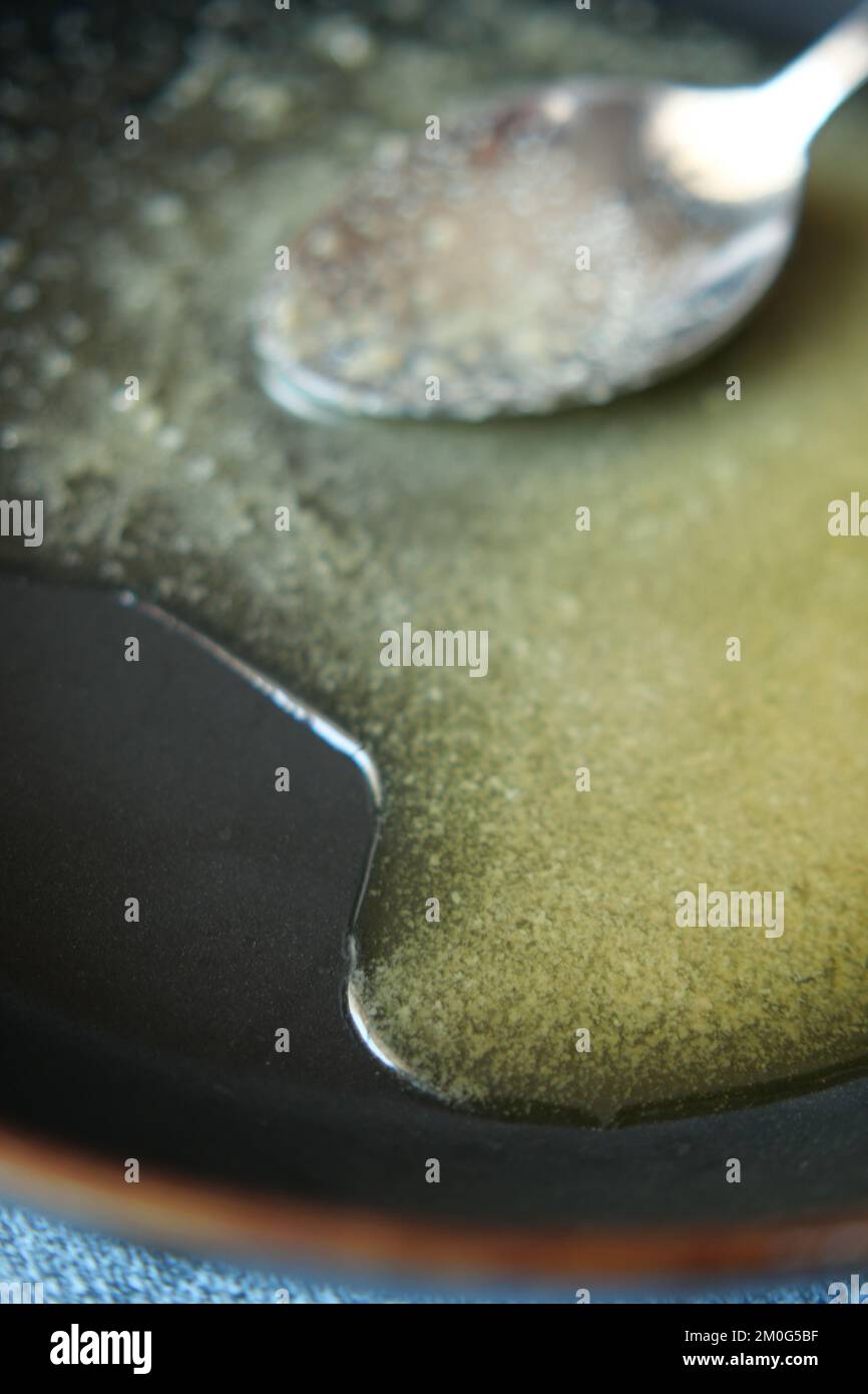 homemade ghee in a cooking pan Stock Photo - Alamy