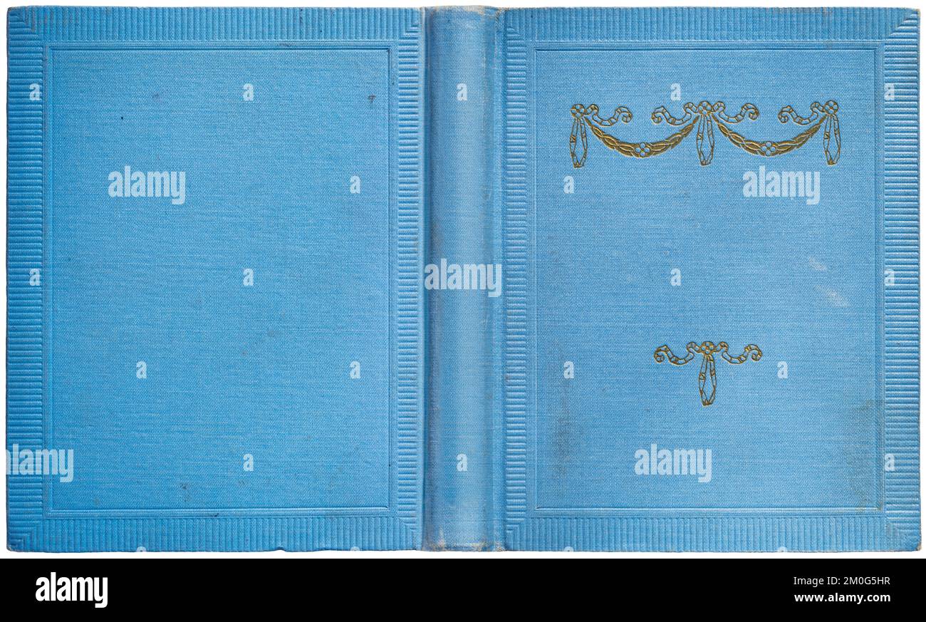 Old open book cover in red canvas and embossed golden decorations ...