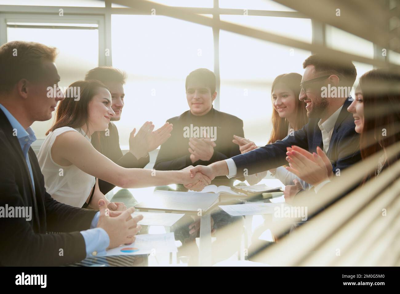 business partners shaking hands during negotiations in the office Stock ...