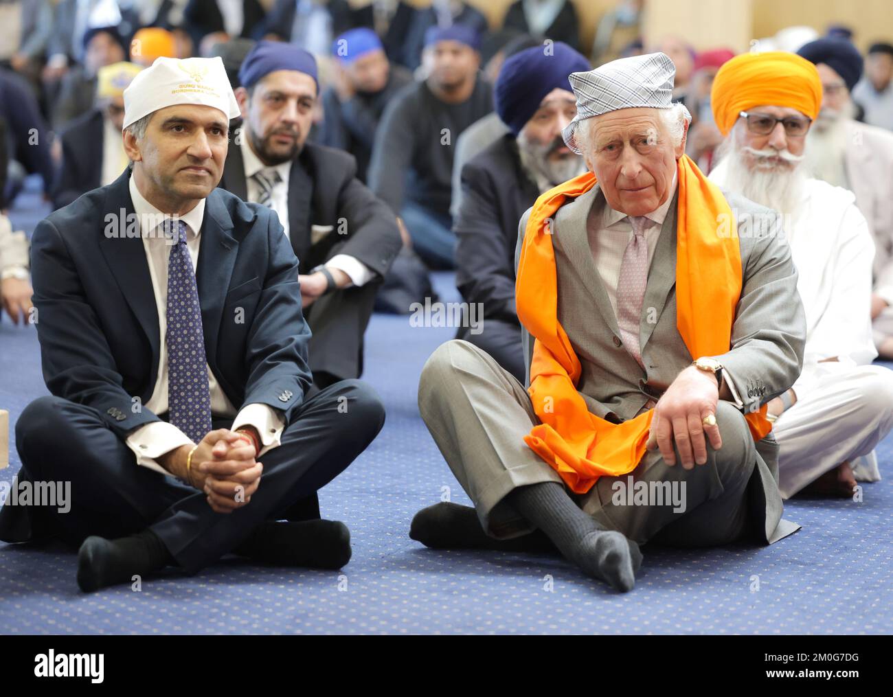 King Charles III sits on the floor in the Prayer Hall with Professor ...