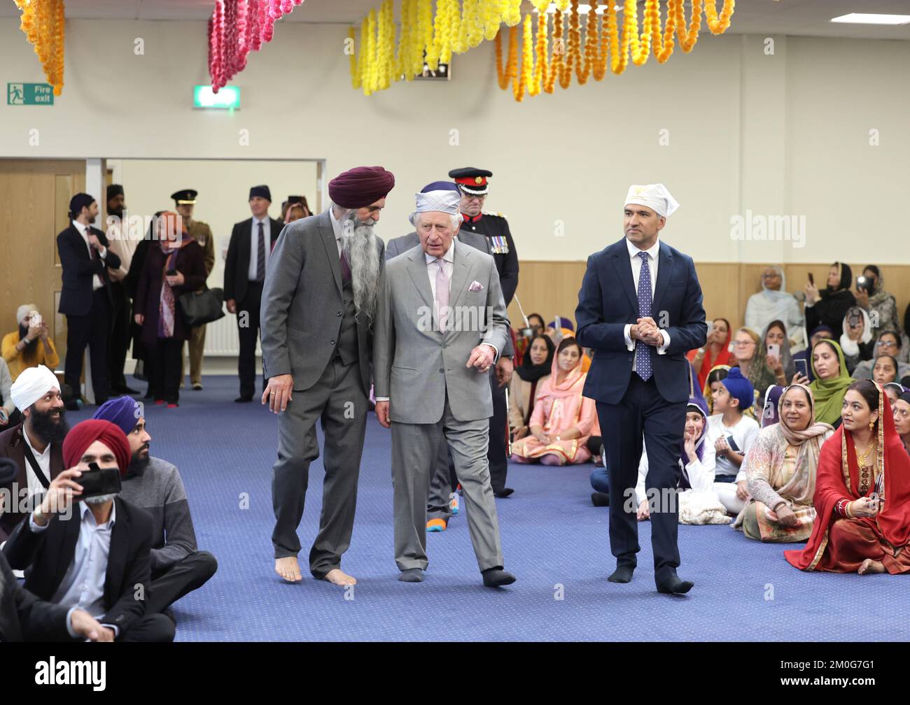 King Charles III enters the Prayer Hall with Professor Gurch Randhawa ...