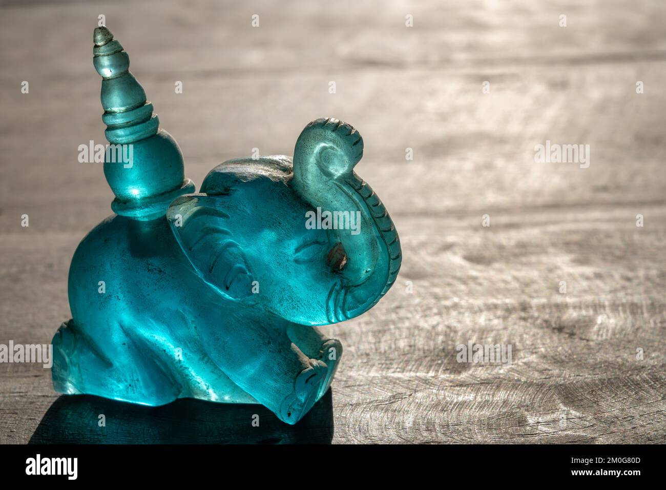 Beautiful backlit translucent blue crystal buddhist statue of kneeling ... Beautiful backlit translucent blue crystal buddhist statue of kneeling ...