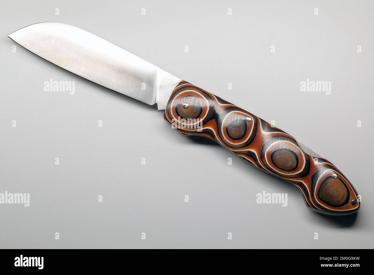 Jackknife with open sharp steel blade and polymer handle with geometric ...