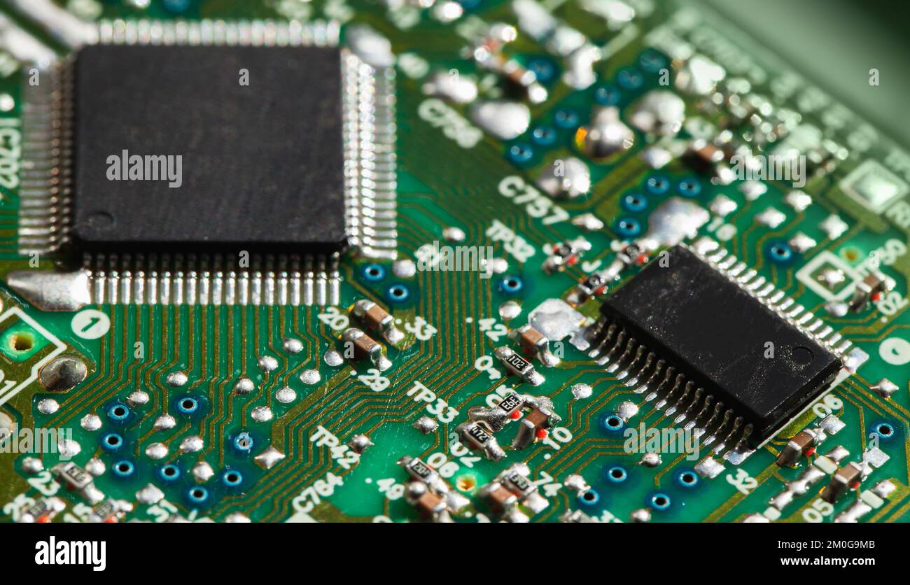 Microchips mounted on a printed circuit board, close up photo with ...