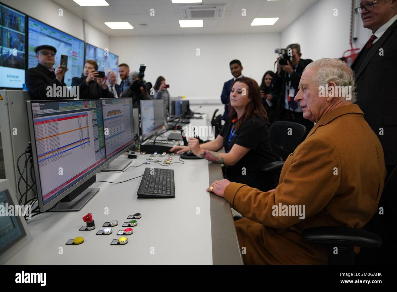 King Charles III is shown the control room during a visit to Luton DART ...