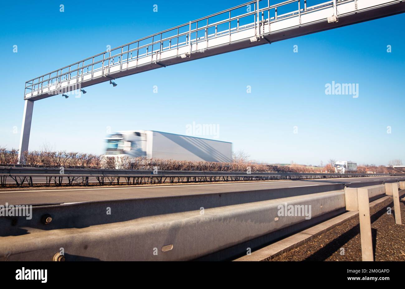 Trucks passing through the toll gate on highway, highway fee ...