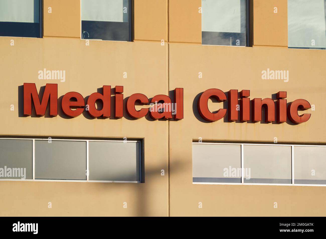 Medical clinic sign on office building exterior Stock Photo - Alamy