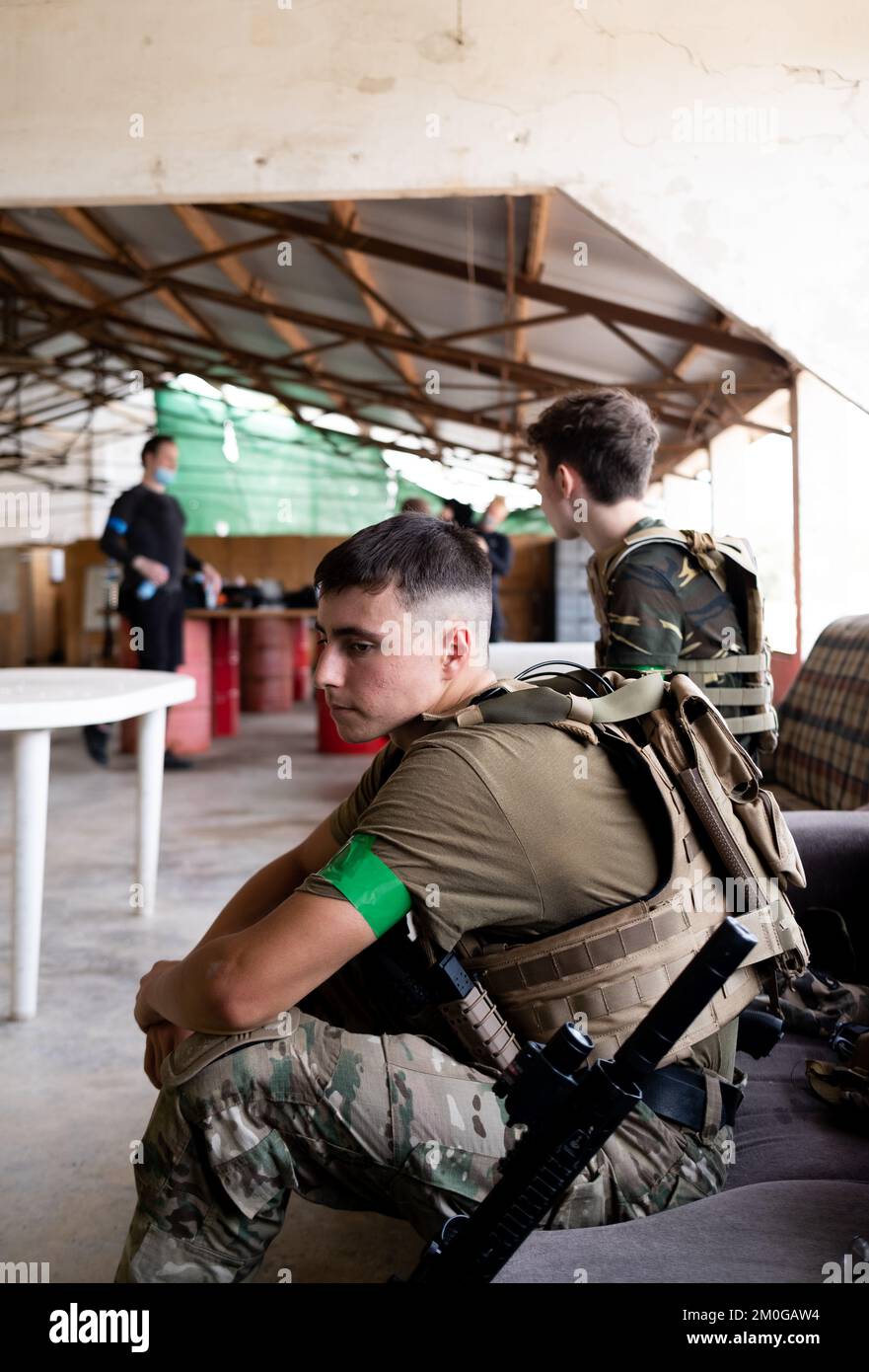 Two teenagers equipped with military clothing eagerly await the start ...