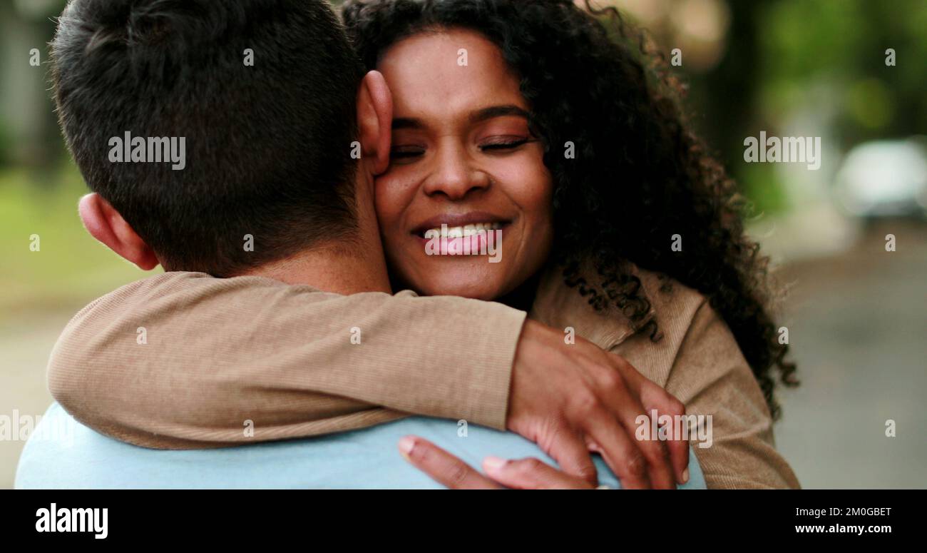 Beautiful African woman embracing boyfriend, loving caring relationship ...