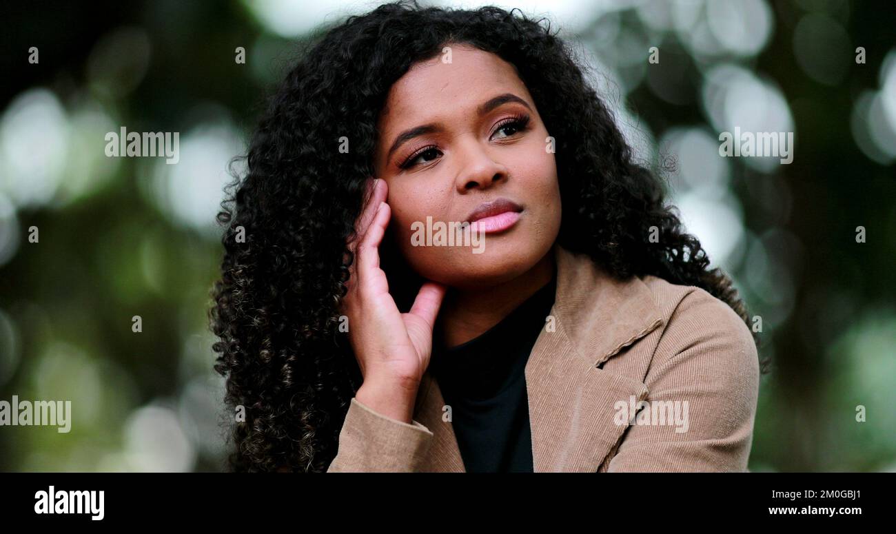 Black woman feeling regret and frustration outside Stock Photo - Alamy