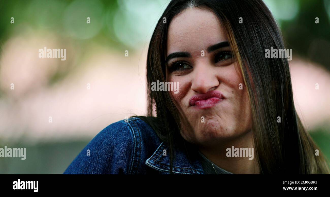 Candid woman grimacing pouting with mouth. pout Stock Photo - Alamy