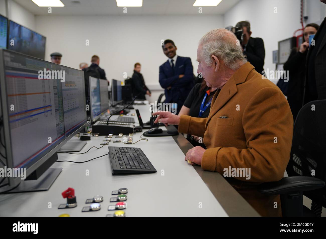 King Charles III is shown the control room during a visit to Luton DART ...