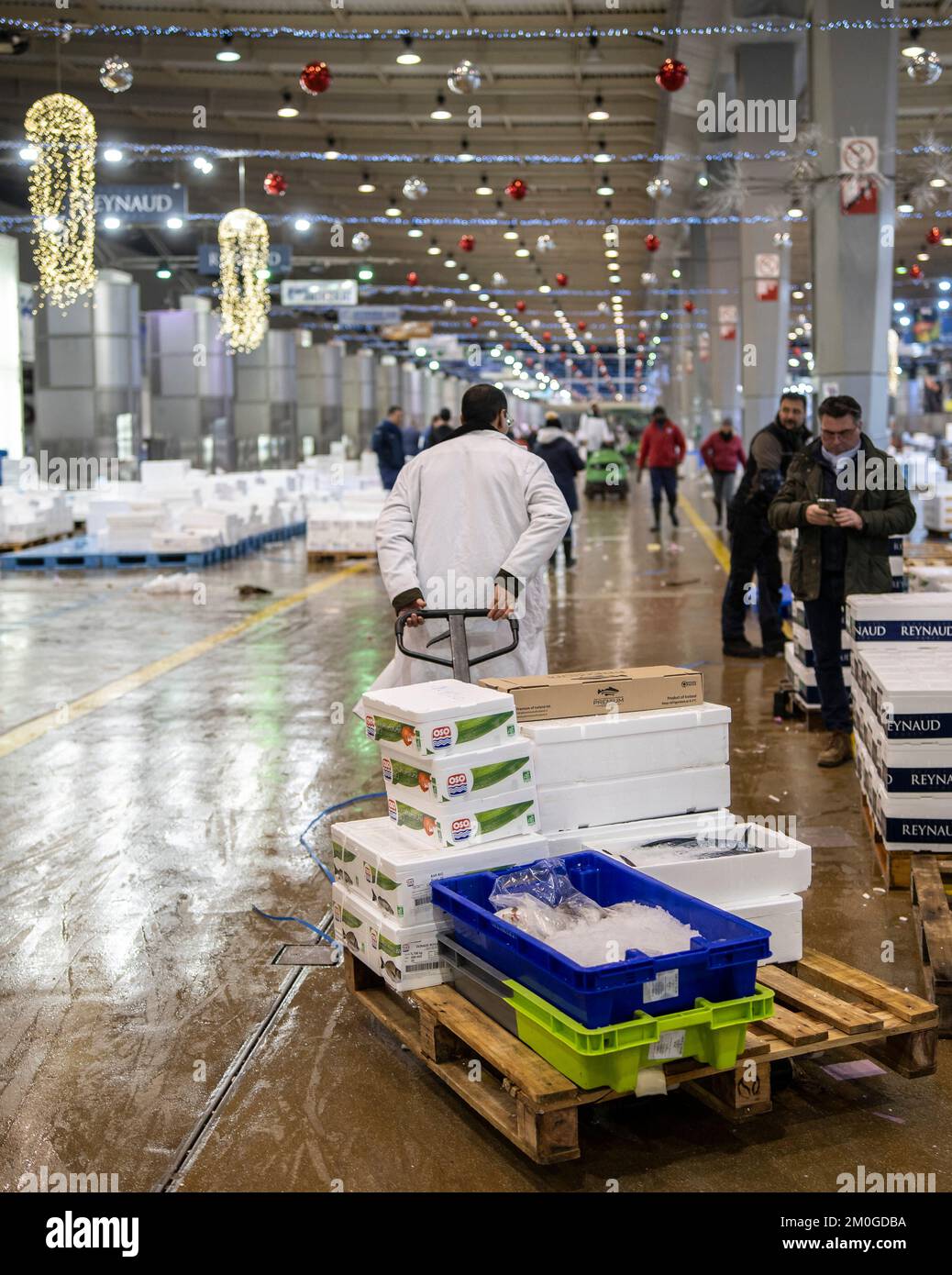 Staff work in the seafood pavilion at Rungis International wholesale ...