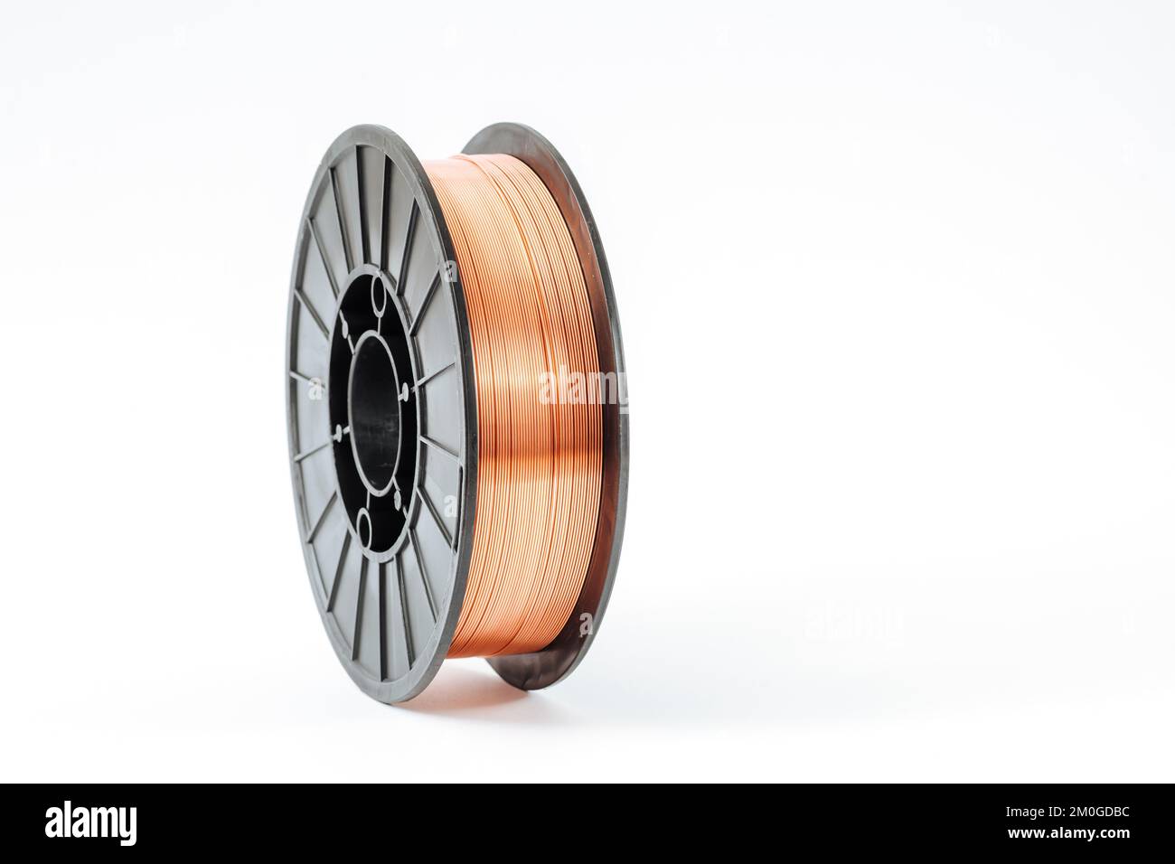 Welding wire spool on a white background Stock Photo - Alamy