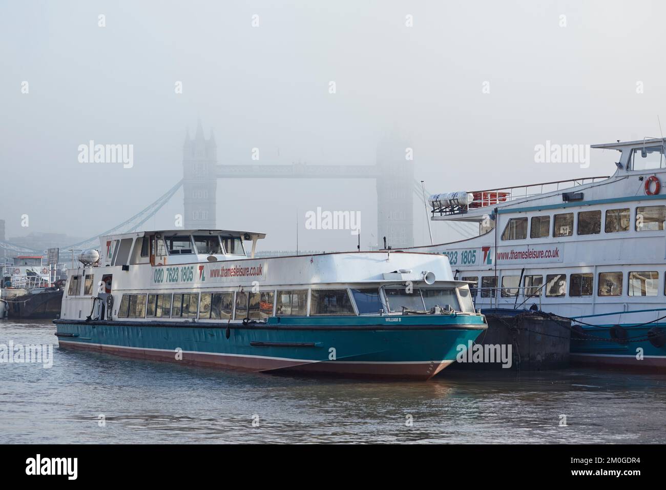 Tower Bridge with passenger boat for tours on the Thames in the ...