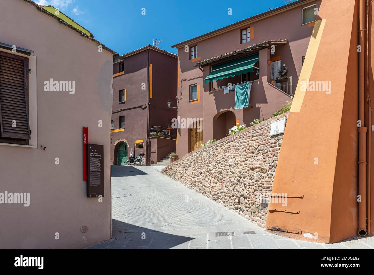 via di mezzo and colored houses, ghizzano, italy Stock Photo - Alamy