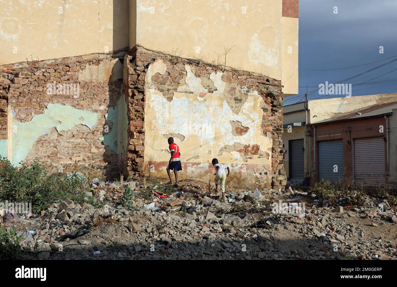 Boys in East Africa playing in the ruins of a demolished building Stock ...