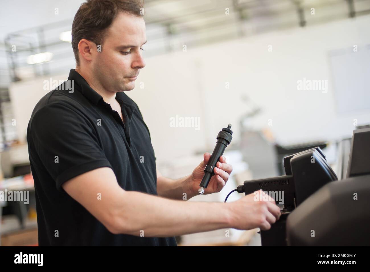Office machine repairer hi-res stock photography and images - Alamy