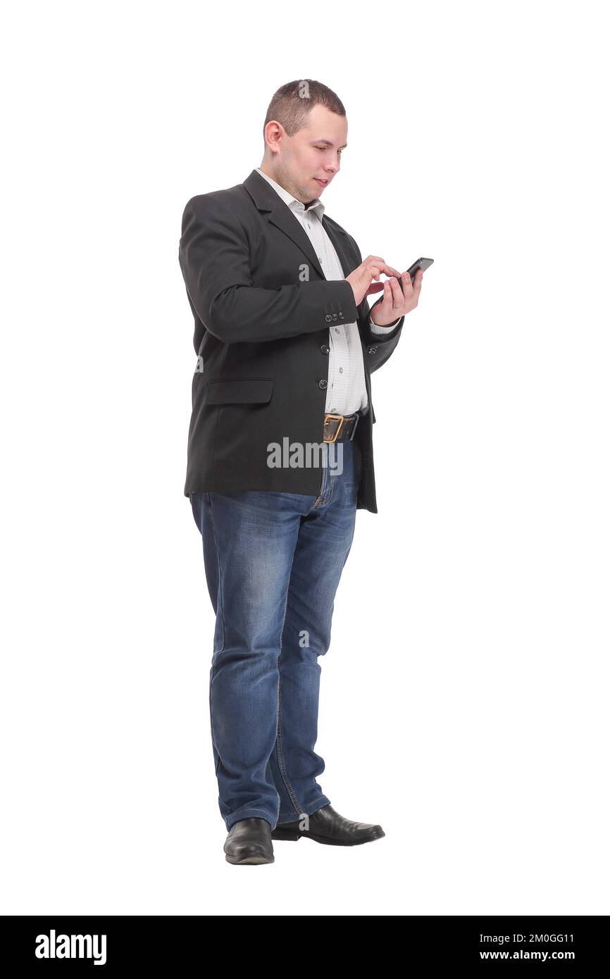 Young adult man talking on the phone standing over white background ...