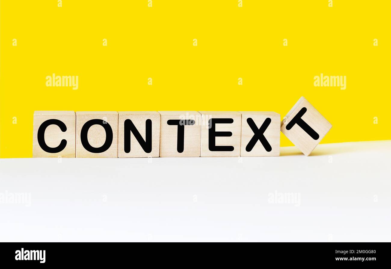 CONTEXT The word is written on wooden cubes and a white and yellow ...