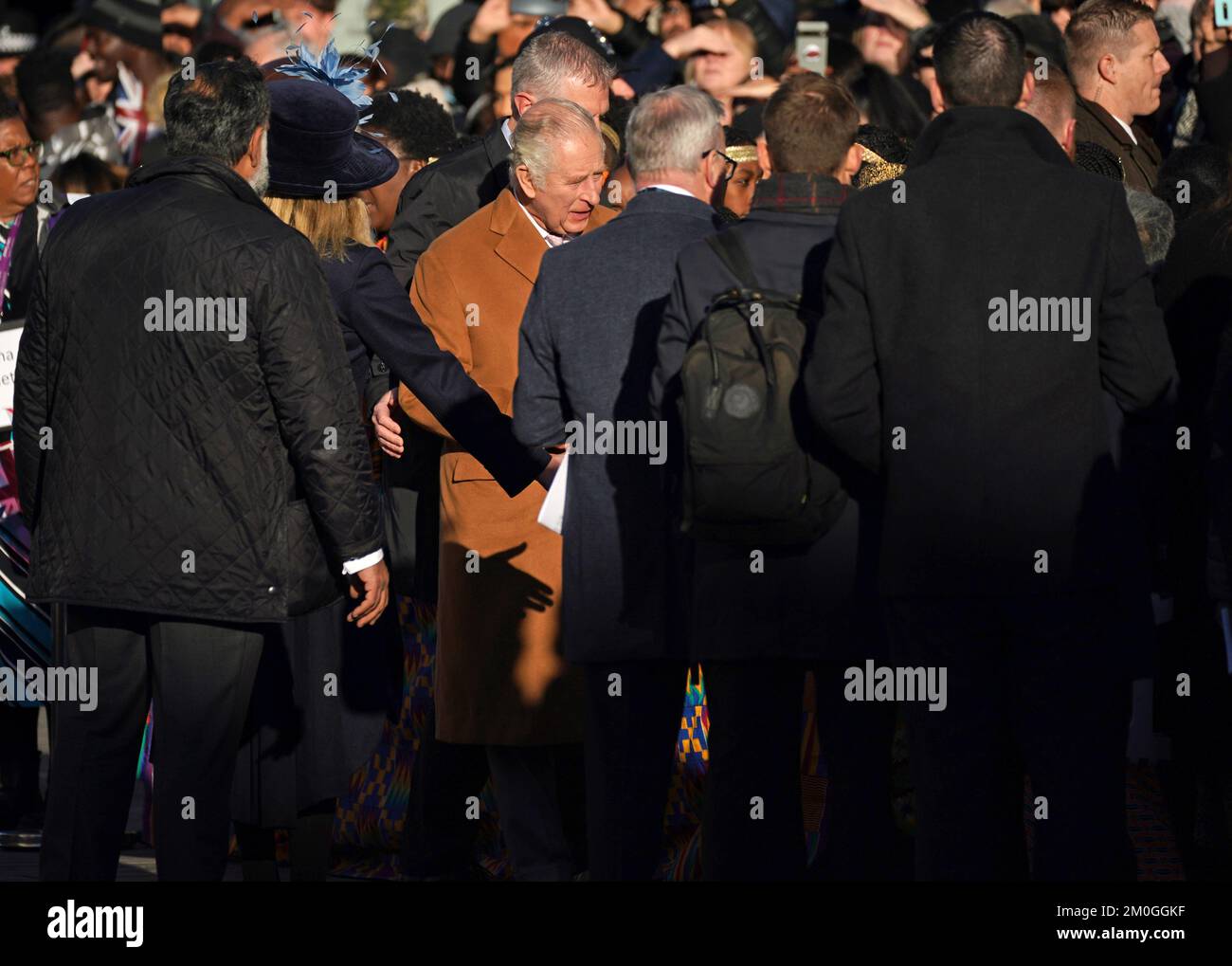 Close-protection officers usher King Charles III out of the way as he ...