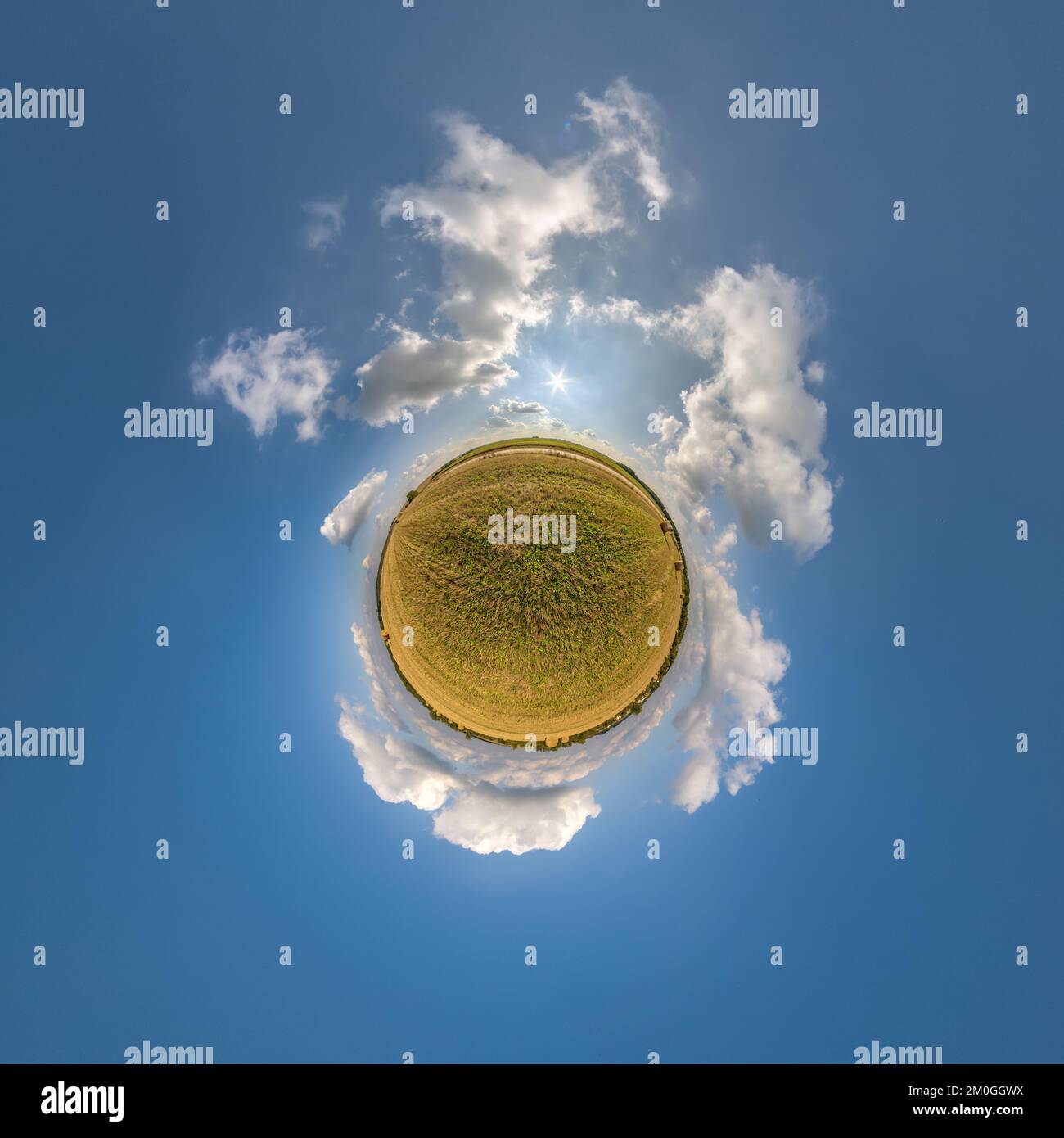 green tiny planet in blue sky with beautiful clouds with transformation ...