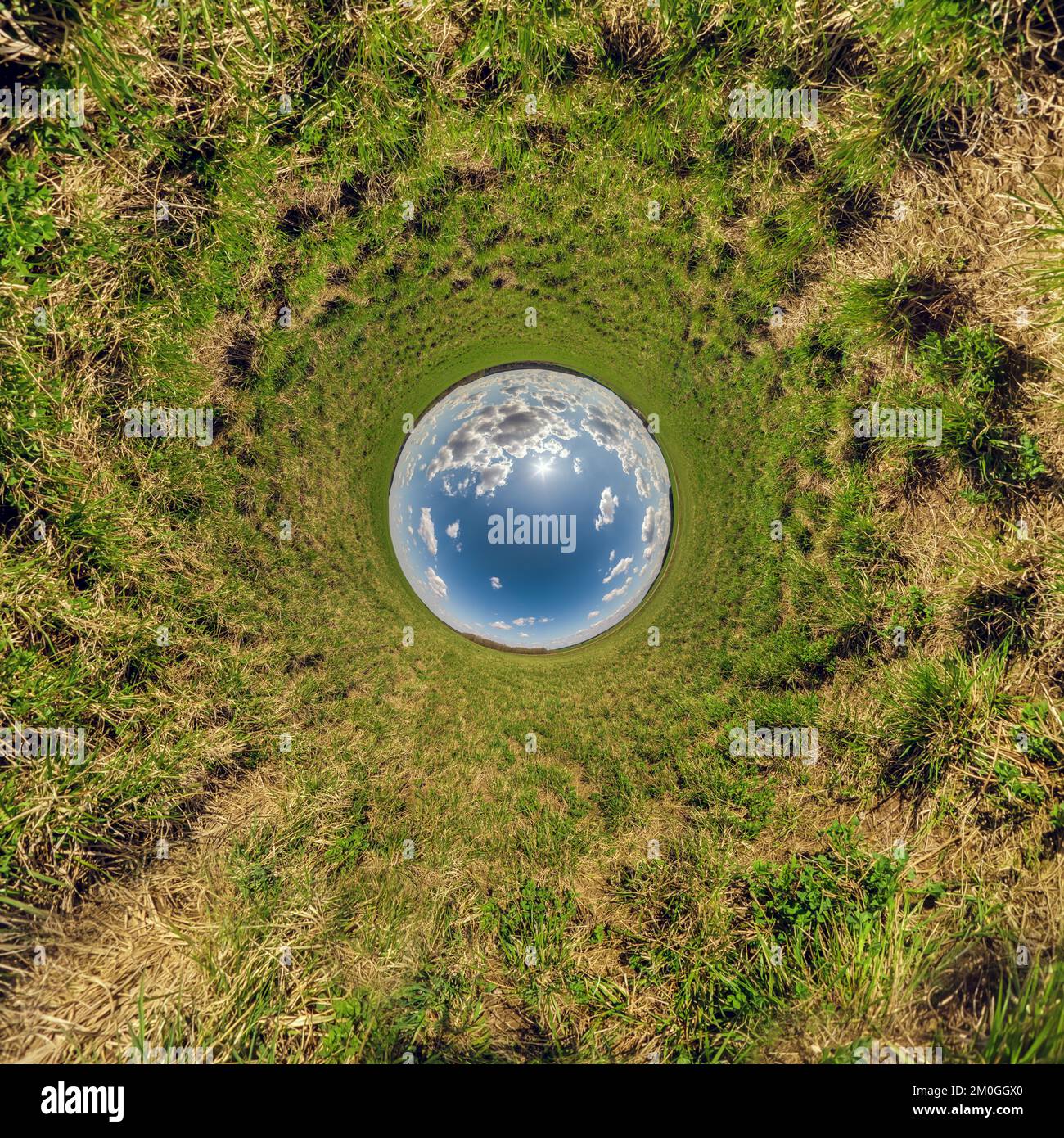 blue hole sphere little planet inside green grass round frame ...