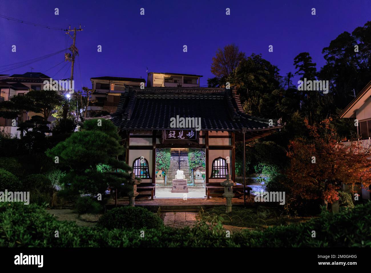 Small Japanese shrine in quiet residential neighborhood at night Stock ...