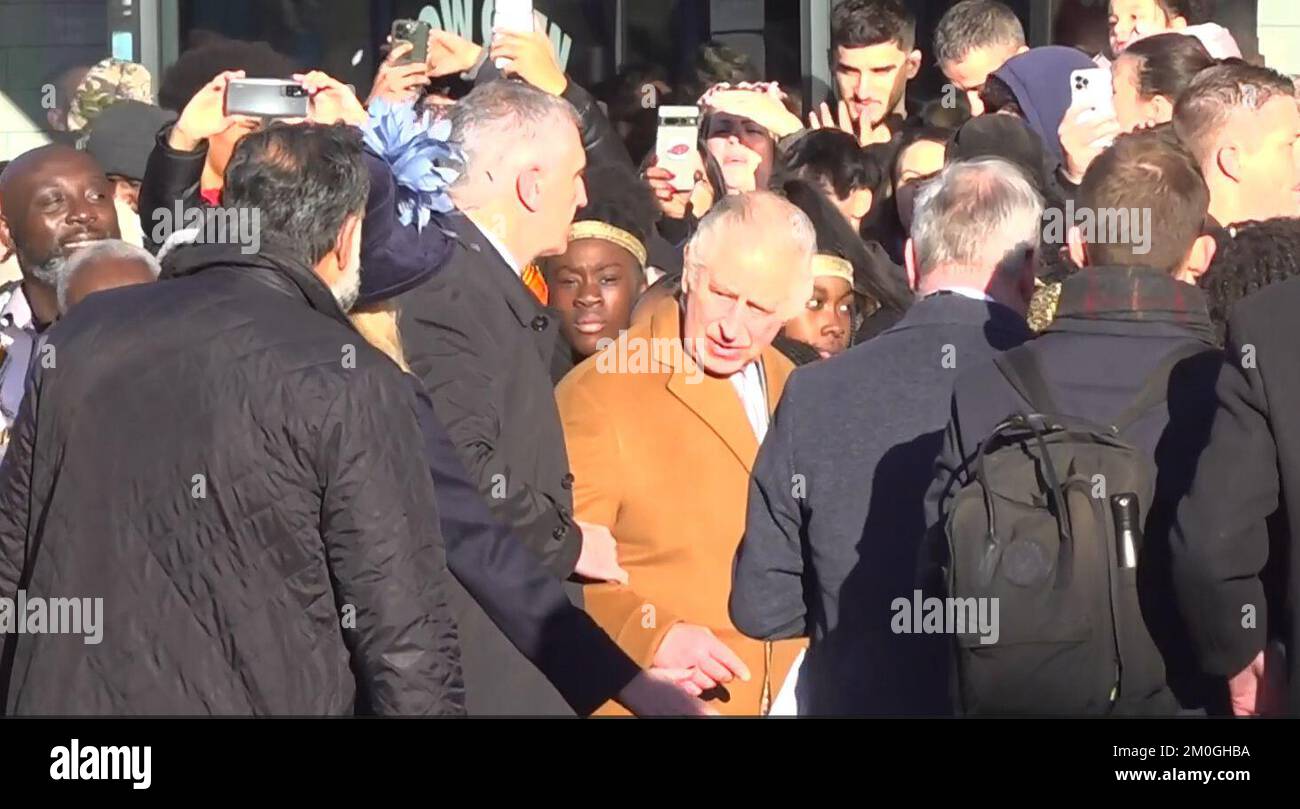 Screen grab taken from PA Video of close-protection officers ushering ...