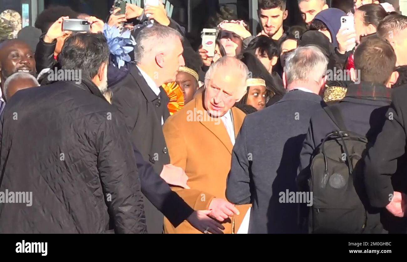 Screen grab taken from PA Video of close-protection officers ushering ...